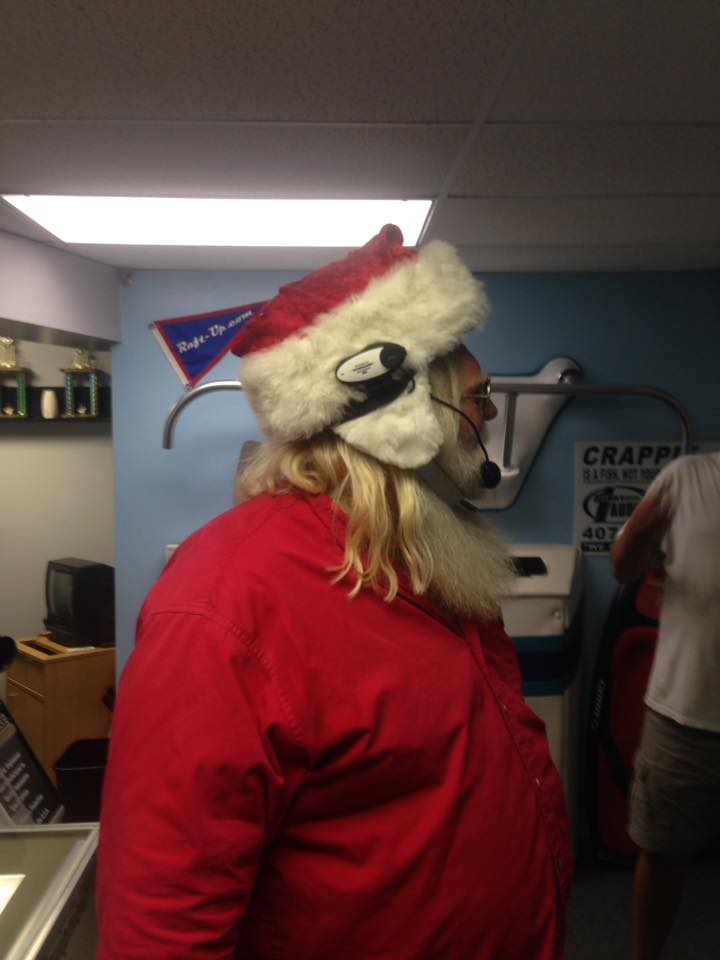 Santa turns his helmet into a custom Santa hat. – https://santabiker.com