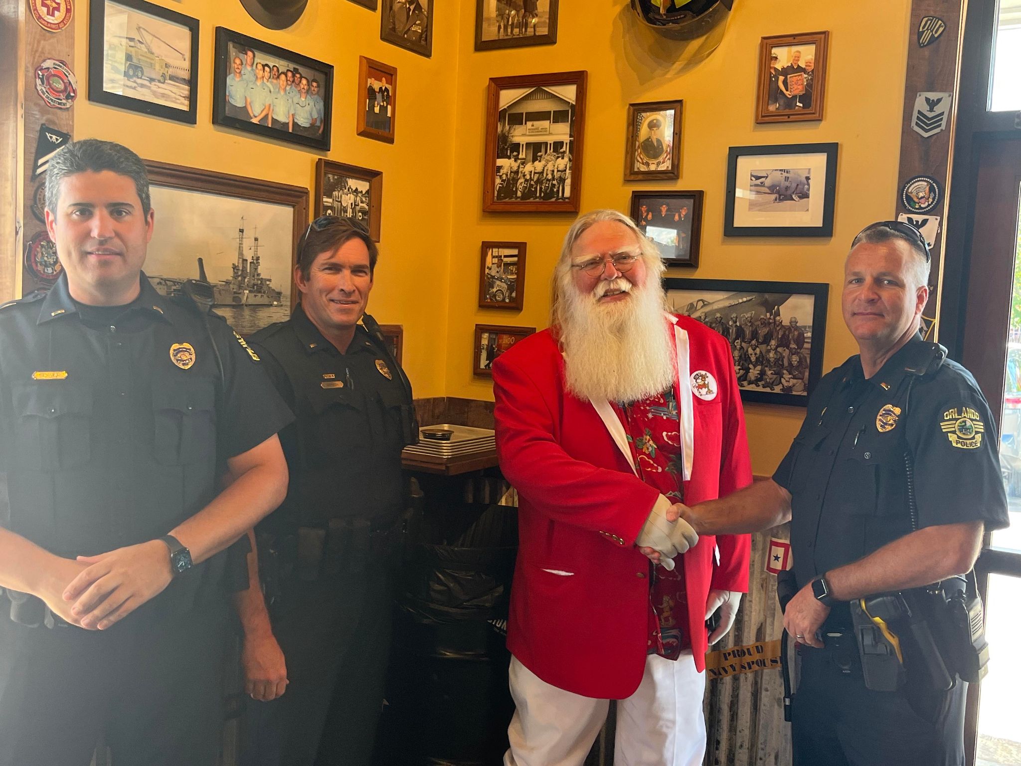 Santa receives an award from an Orlando PD officer & returns a special ...